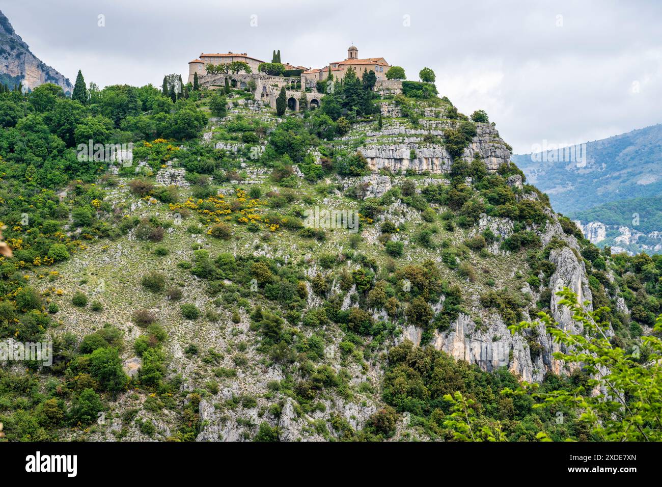 View across valley to the walled medieval hilltop village of Gourdon in ...