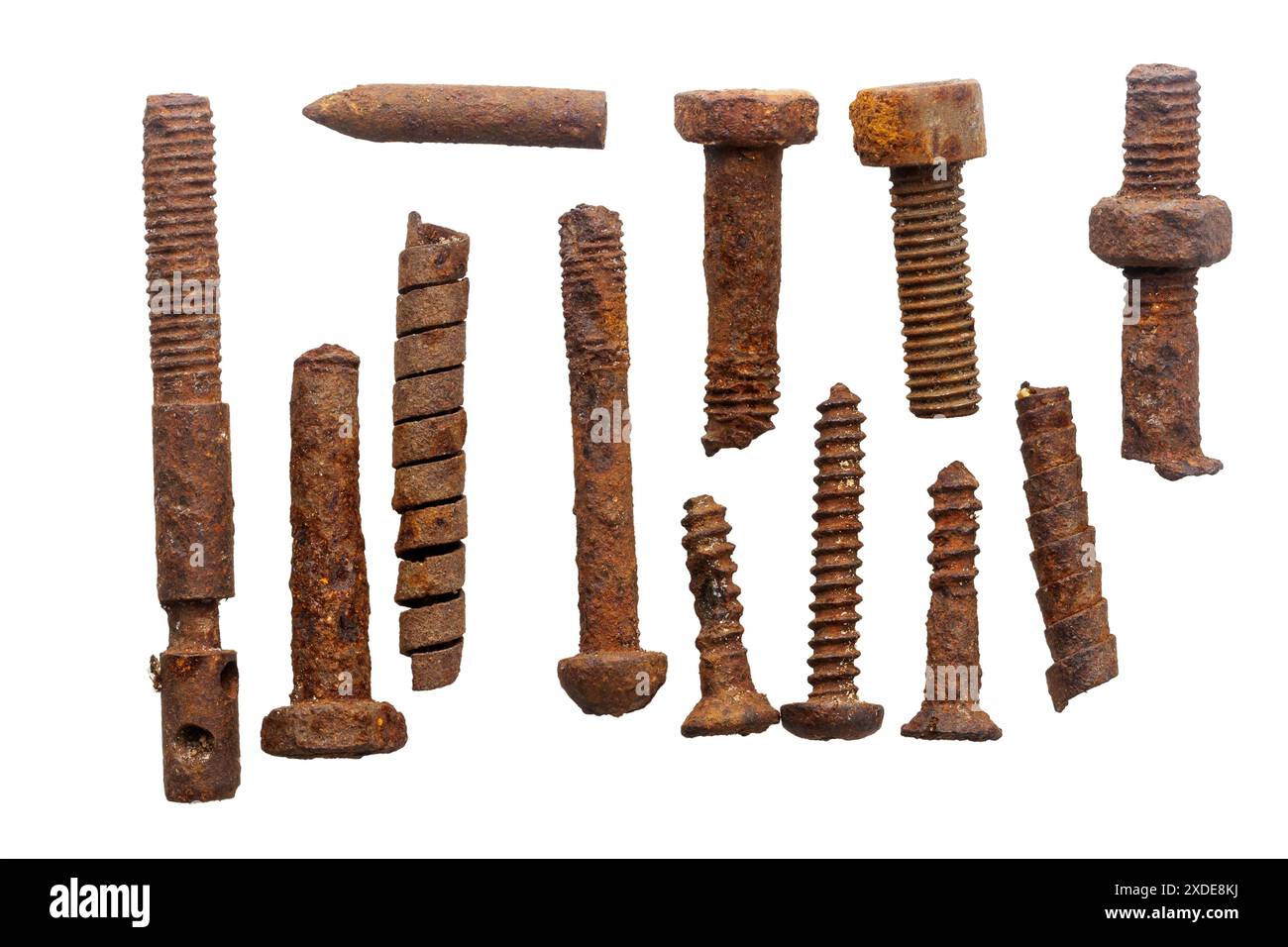 Collection of rusty bolts, screws, and nuts isolated on a white ...