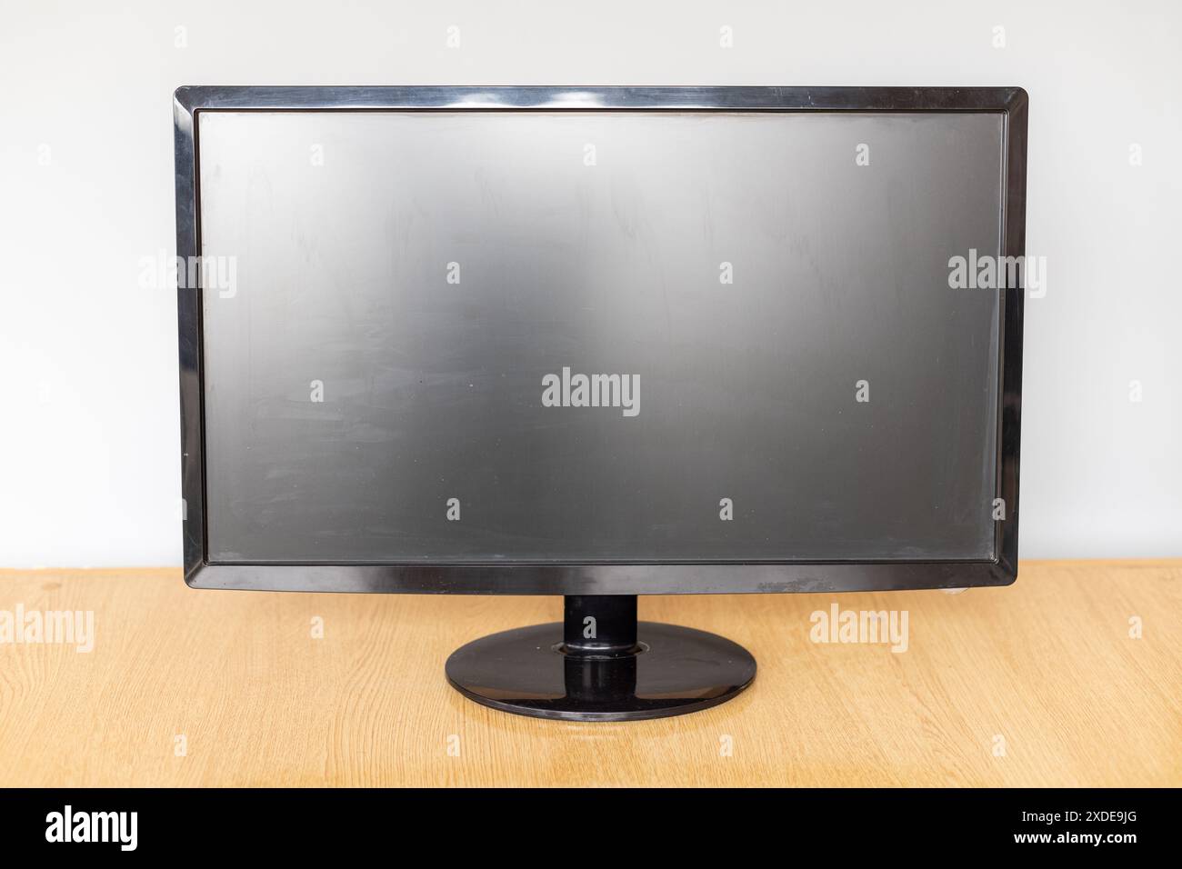 Sleek Black Monitor on a Wooden Desk Stock Photo - Alamy
