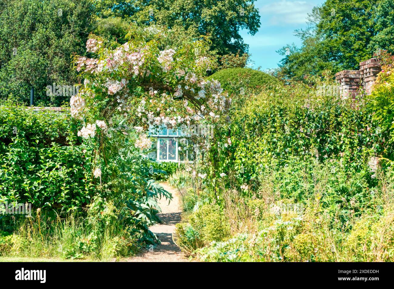 Rose covered archway, walled garden, Hinton Ampner, Hampshire, UK Stock ...