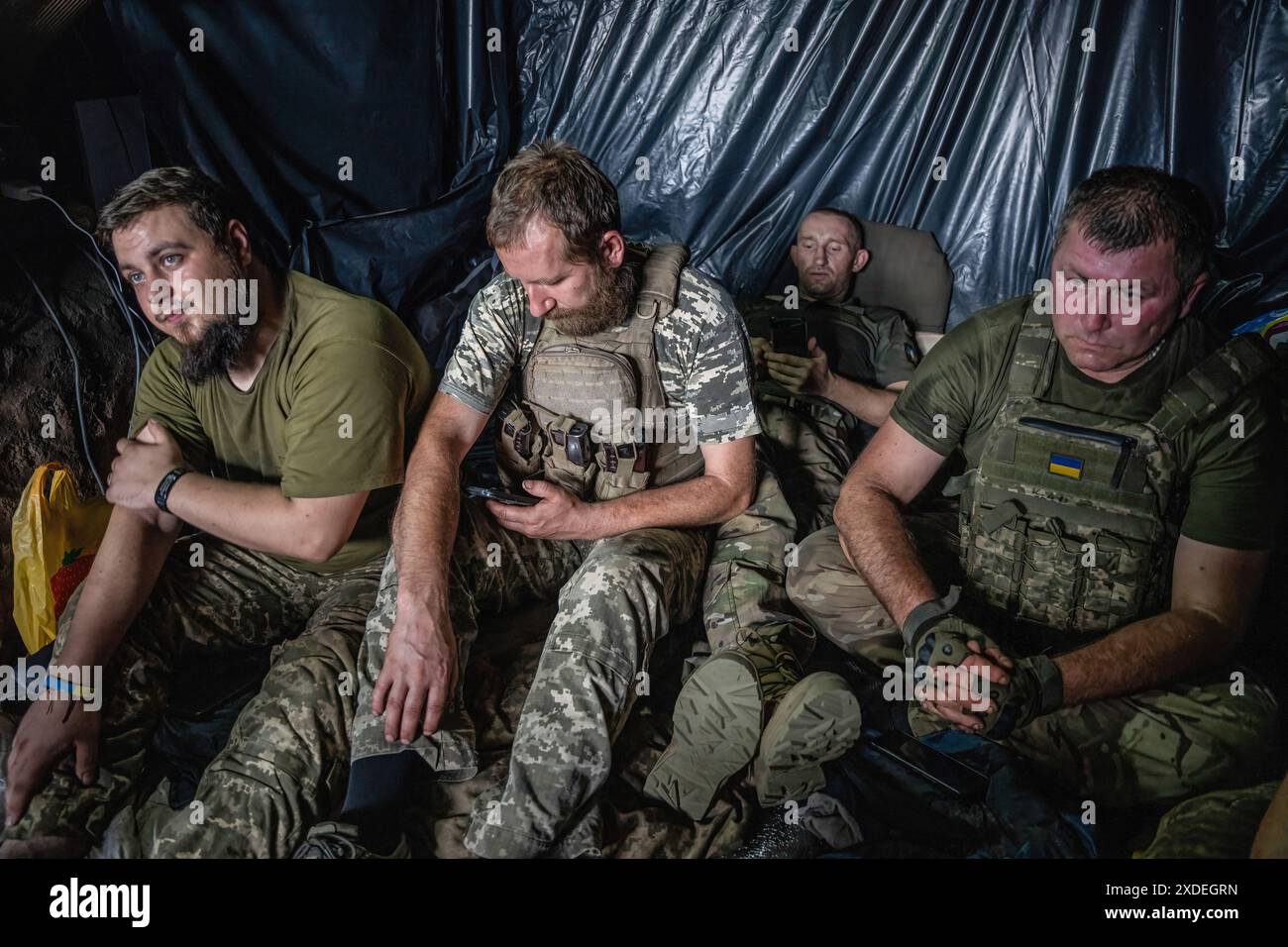 Soldiers from an M109L artillery unit of the 33rd brigade rest inside a ...
