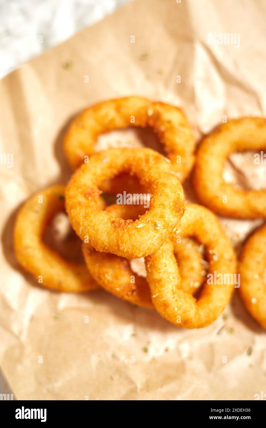 Fried breaded onion rings on white background Stock Photo - Alamy
