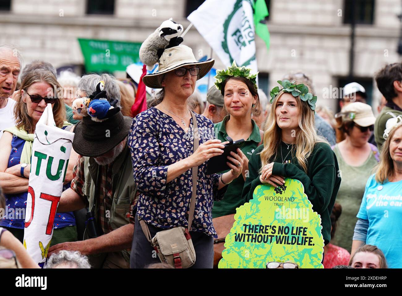 People during a Restore Nature Now rally at Parliament Square in ...
