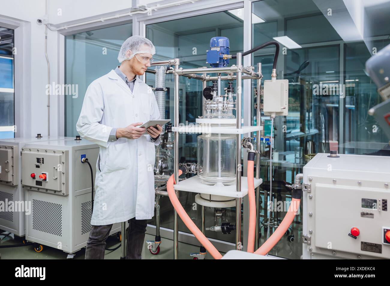Scientist staff working with Equipment in Science Lab. Medical factory ...