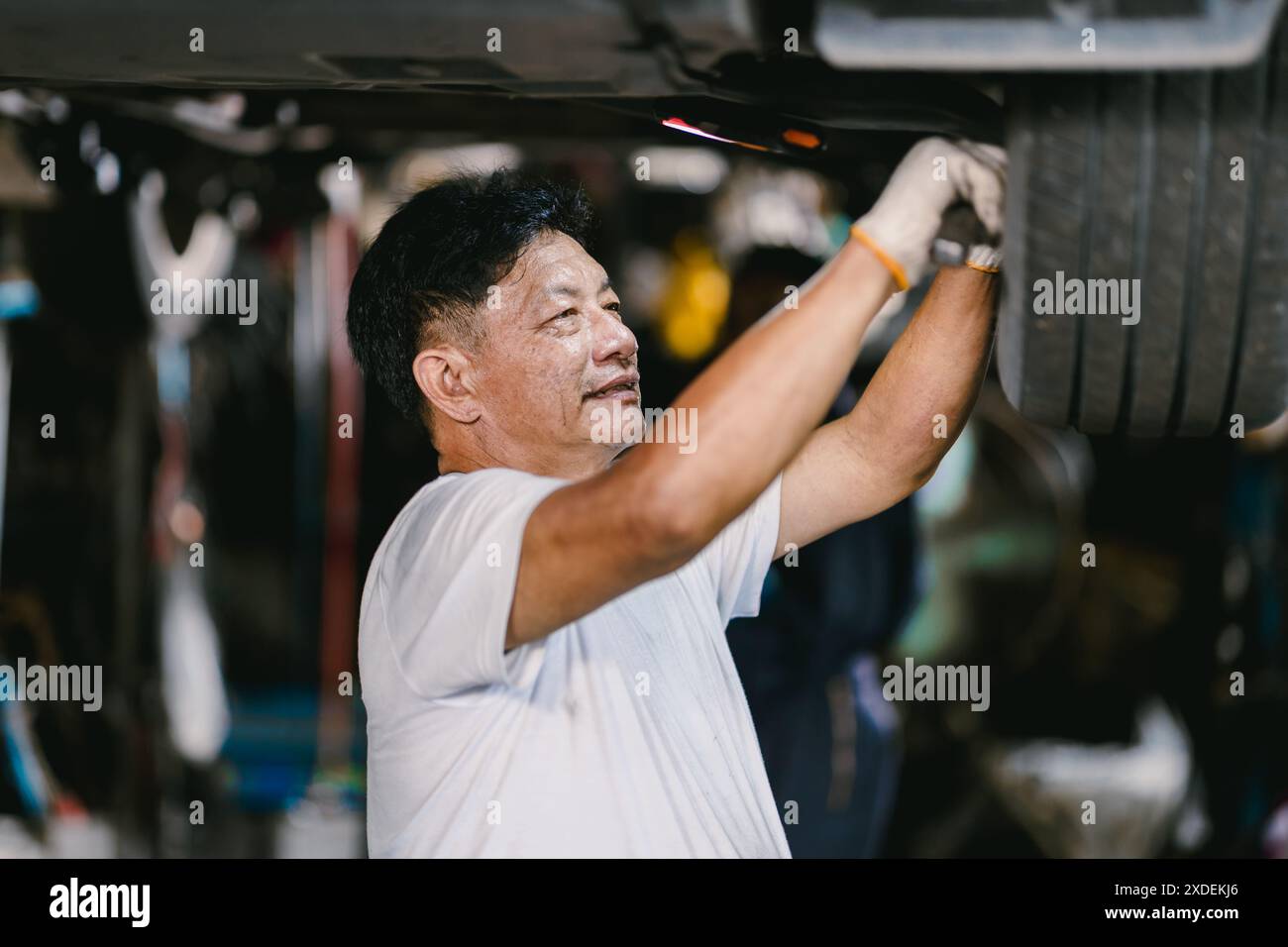 Happy Asian Mechanic man Working Repair Vehicle in Car Service. Worker ...