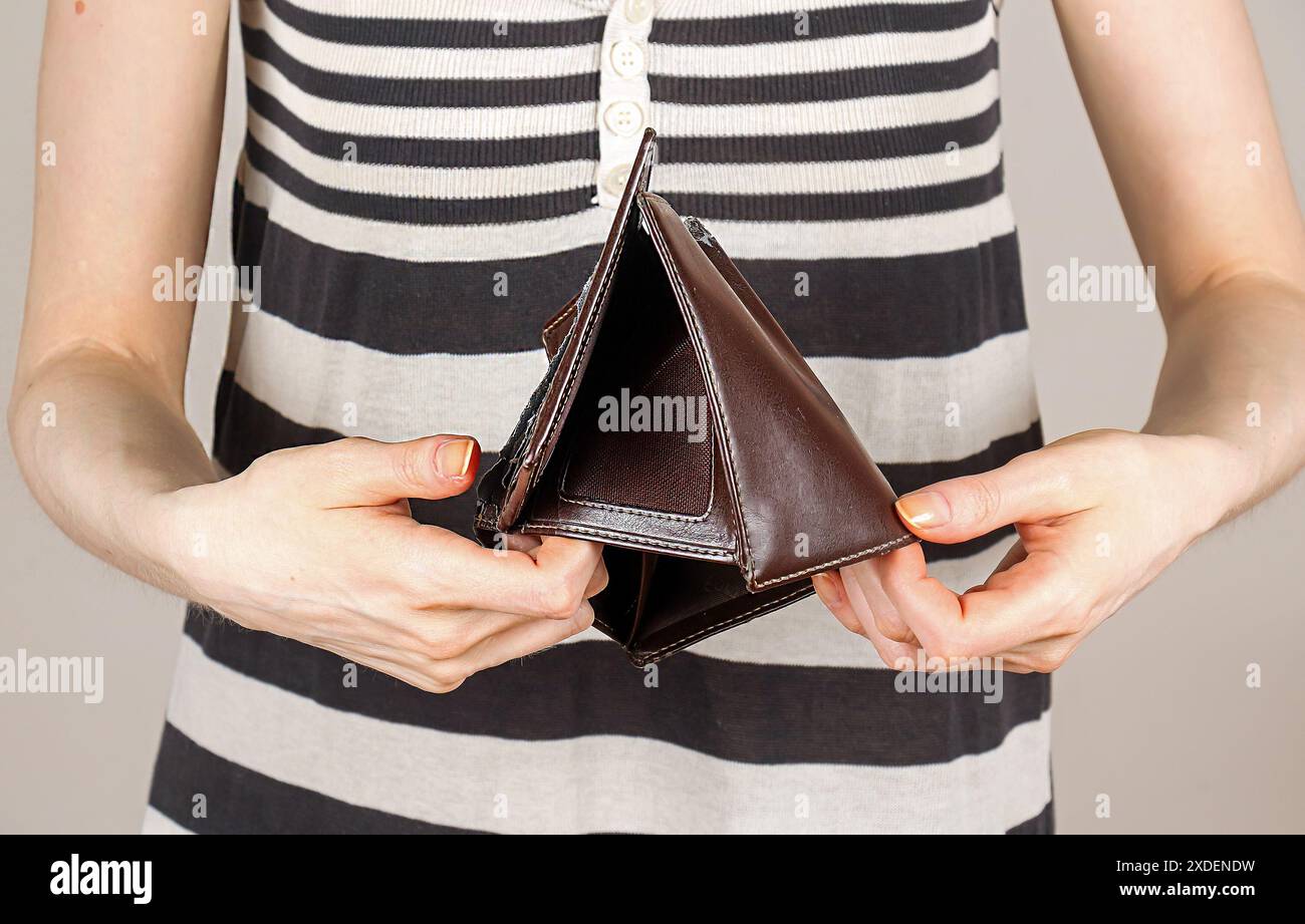 Female hands showing empty leather wallet poverty concept Stock Photo ...
