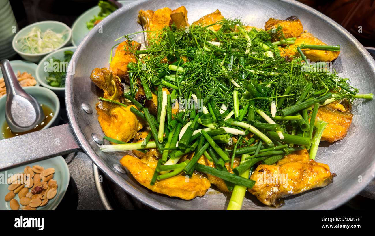 A dish of boneless grilled hemibagrus fish, a type of river catfish ...