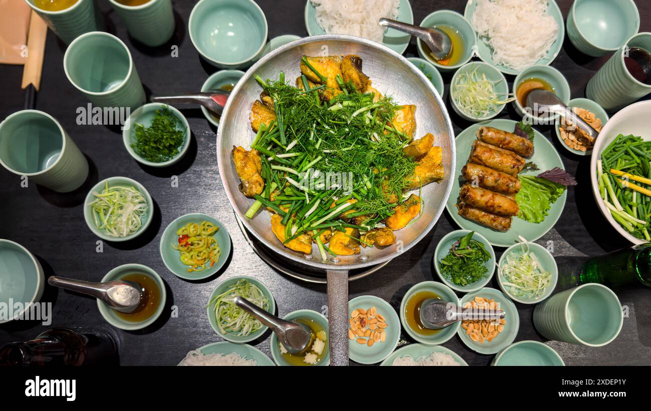 Vietnamese fried spring rolls Cha Gio, with a dish of boneless grilled ...