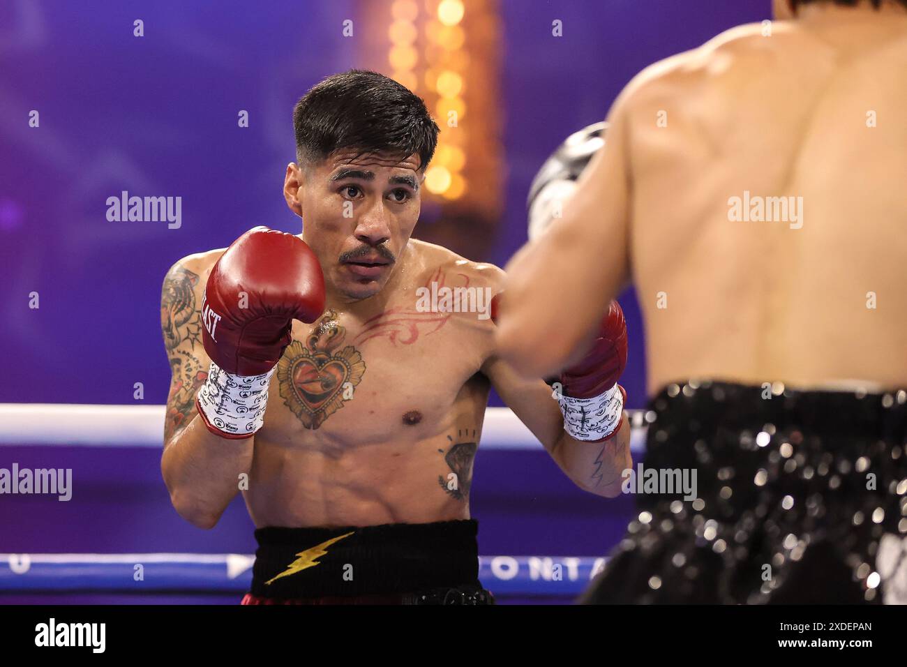 Las Vegas, NV, USA. 21st June, 2024. Francisco Pedroza (L) looks at his ...