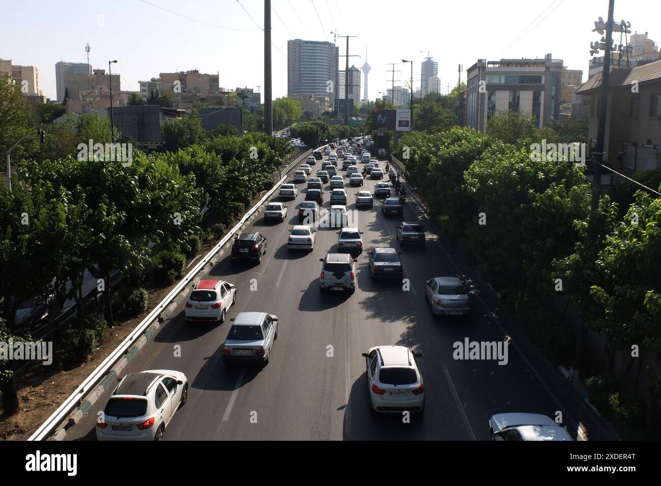Tehran, Iran. 22nd June, 2024. Vehicles drive on Hemmat Expressway with ...