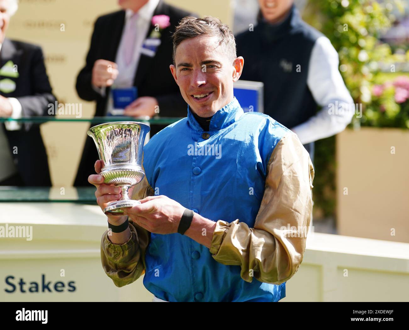 Jockey James Doyle with the trophy after winning the Jersey Stakes on ...