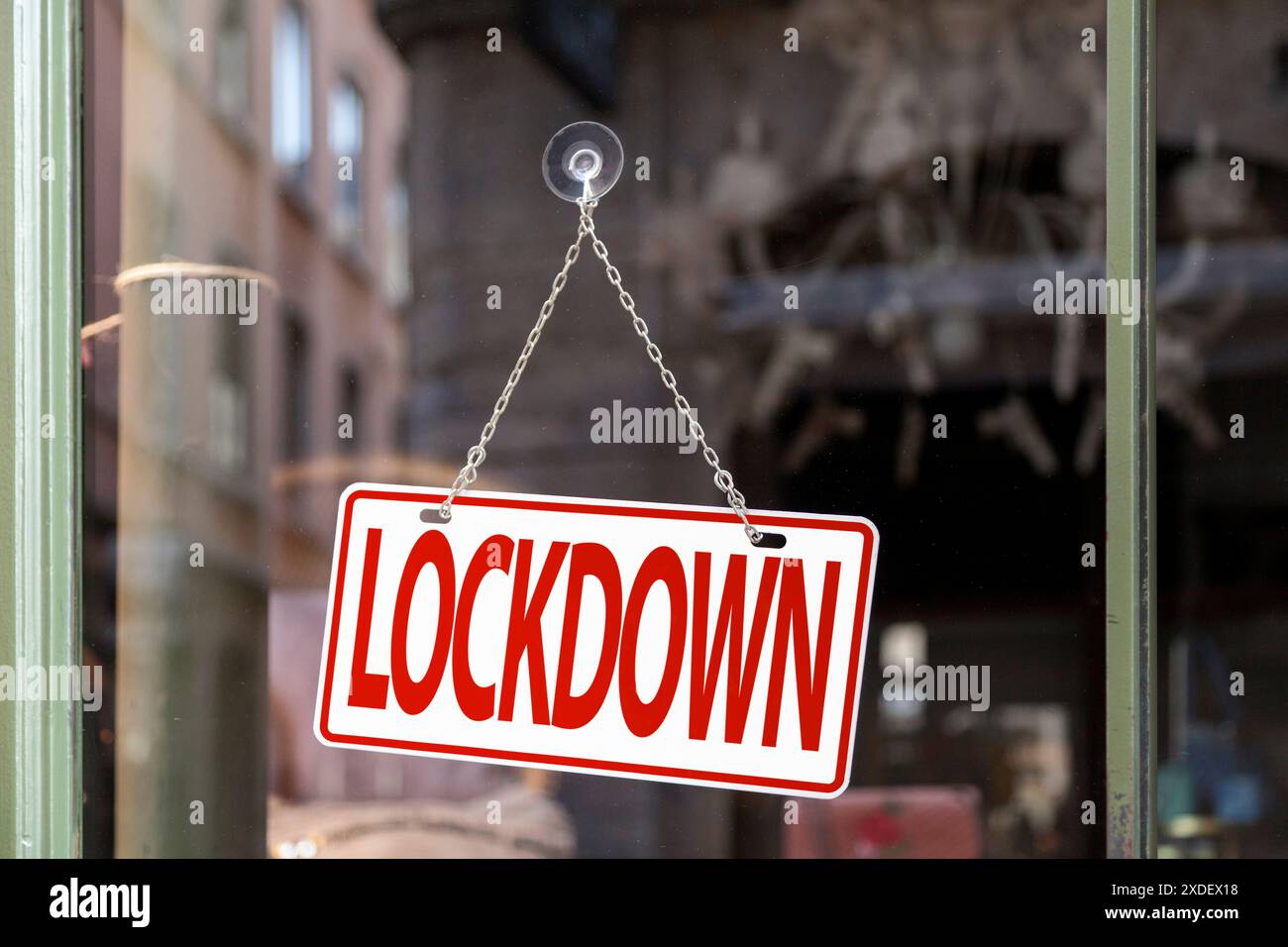 Close-up on a red and white sign in a window with written in it ...