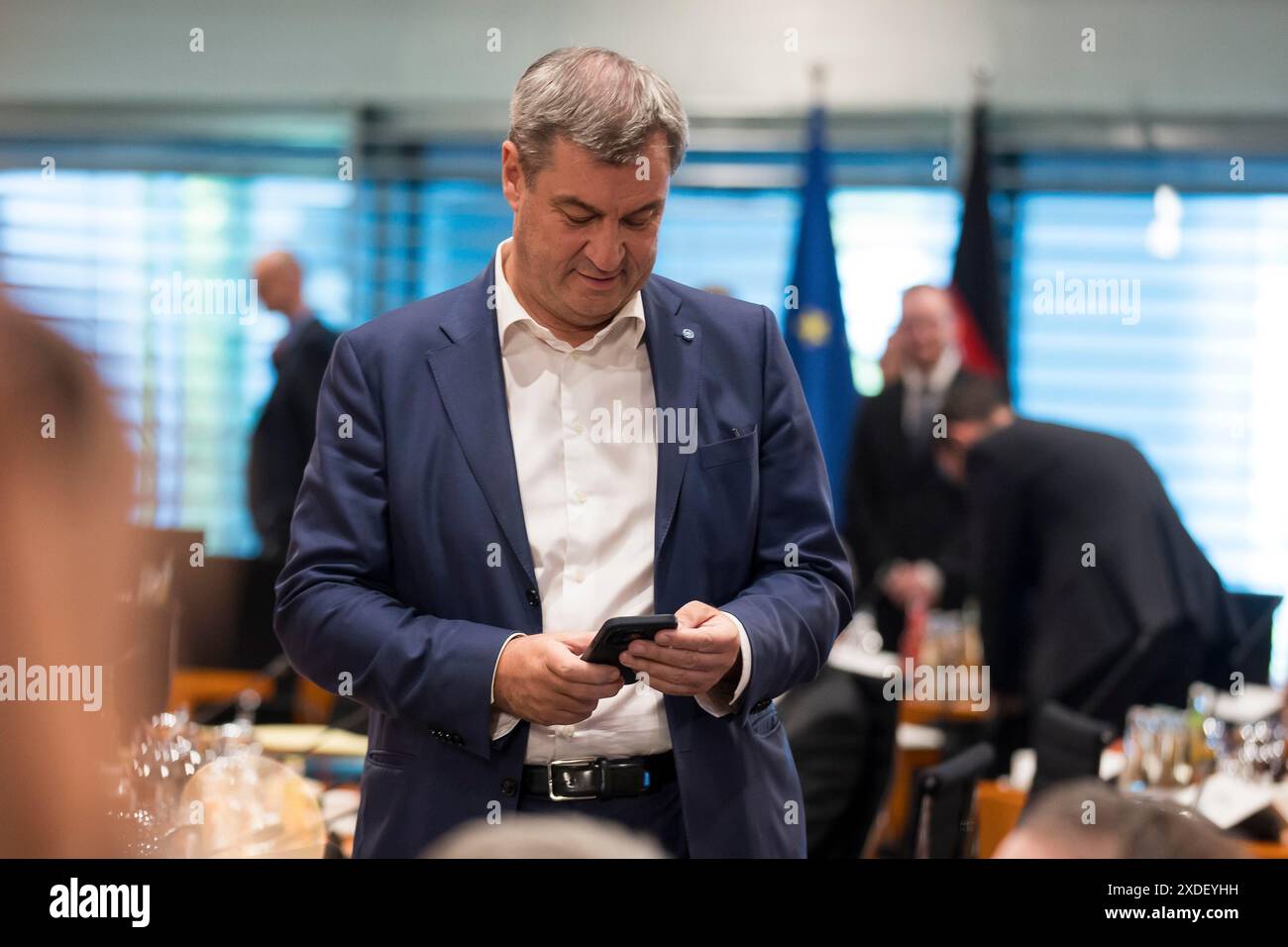 Markus Soeder (Minister President of Bavaria, CSU) on his mobile phone ...