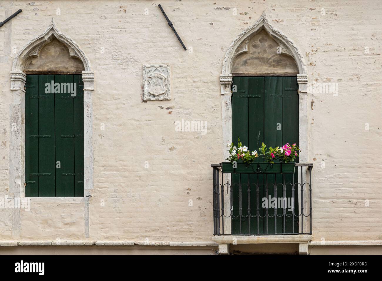 Doors and windows of ancient Venetian houses Stock Photo - Alamy