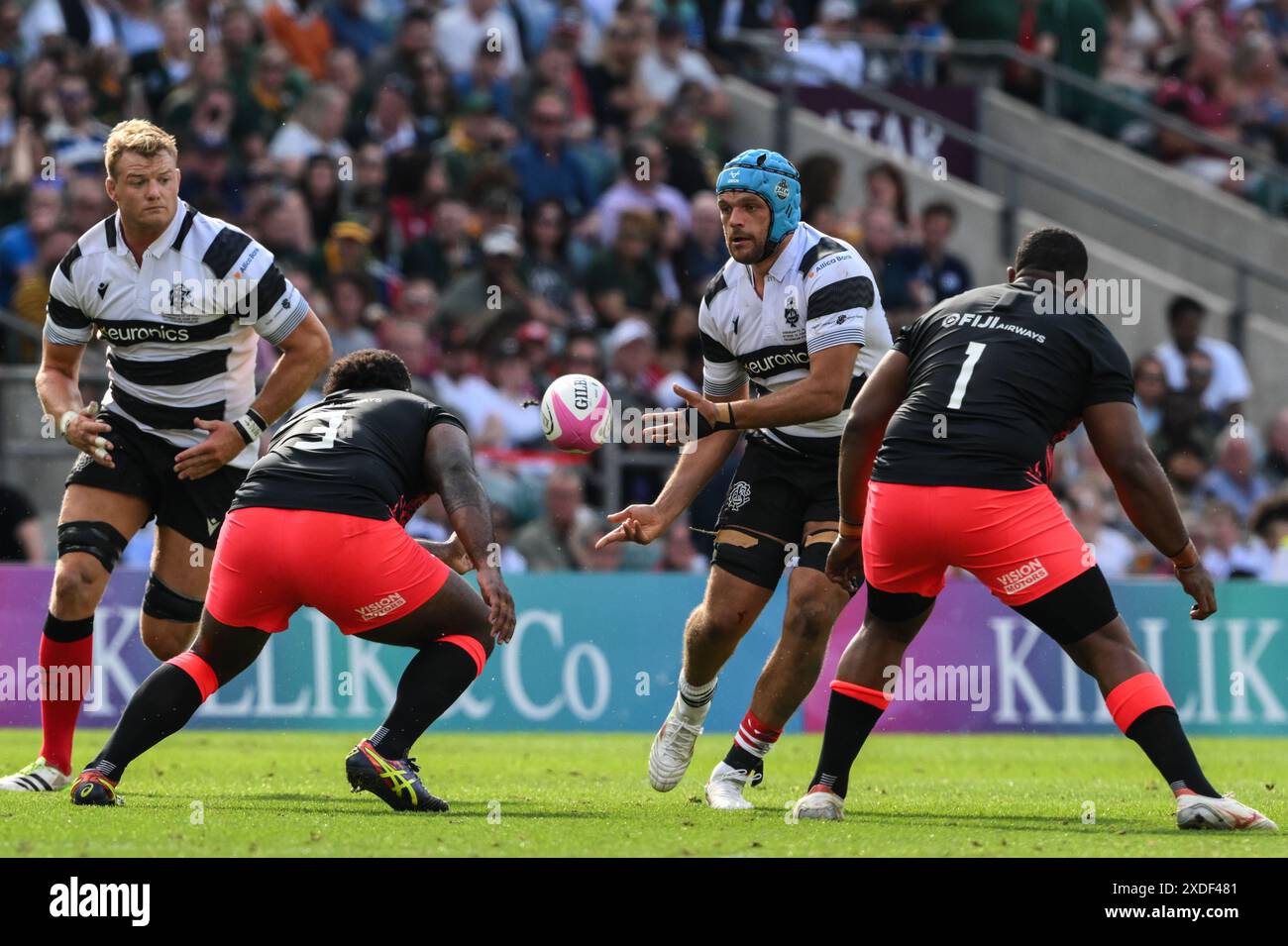 Zach Mercer of Barbarians offloads the ball during the Killik Cup match ...