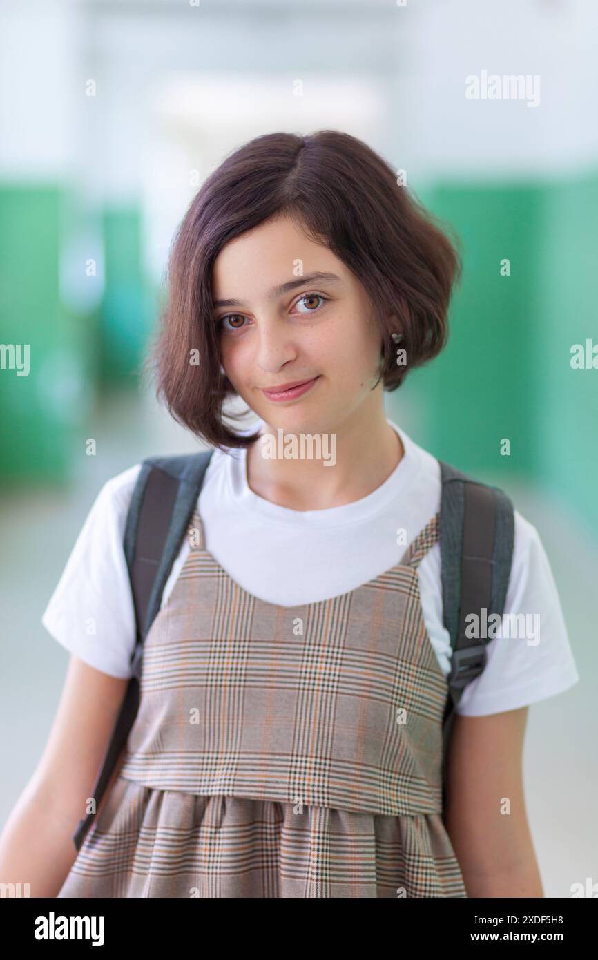 Beautiful girl in a school corridor posing for the camera Stock Photo ...