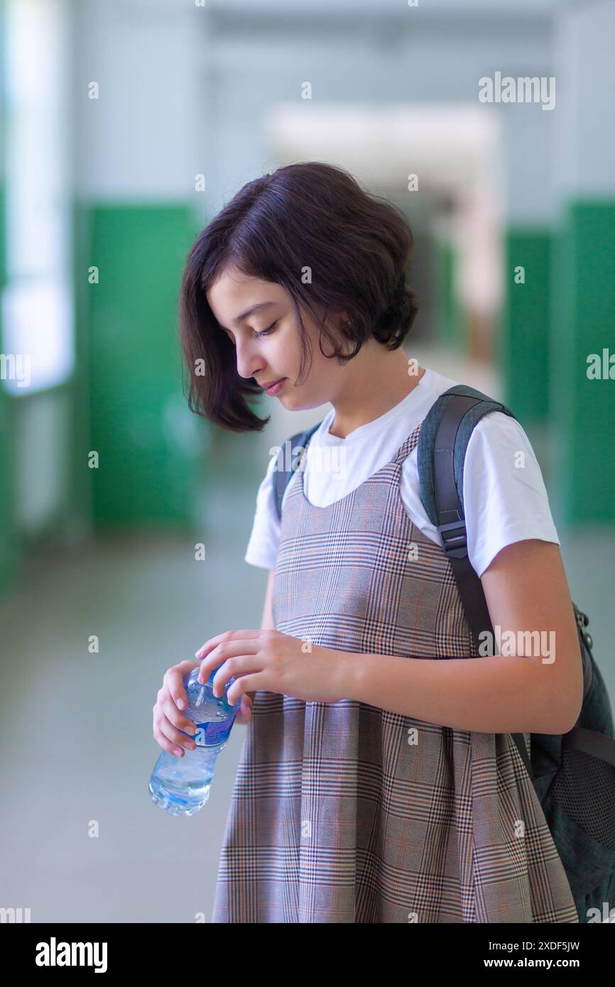 Beautiful girl in a school corridor posing for the camera Stock Photo ...