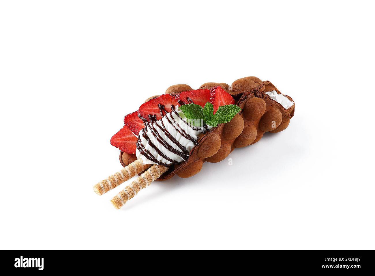 Delicious sweet bubble waffle on white background Stock Photo - Alamy