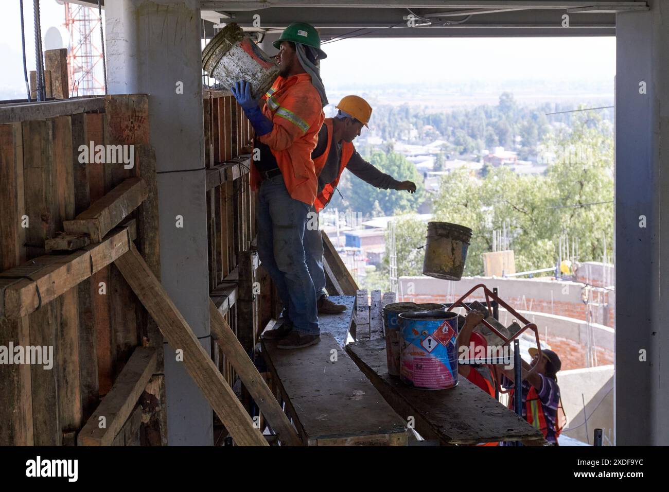 Mexican construction workers cement pouring concrete Stock Photo - Alamy