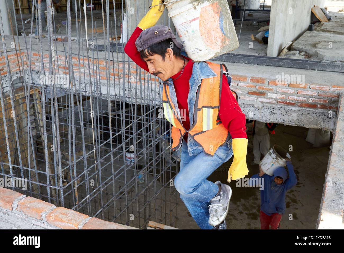 Mexican construction workers cement pouring concrete Stock Photo - Alamy
