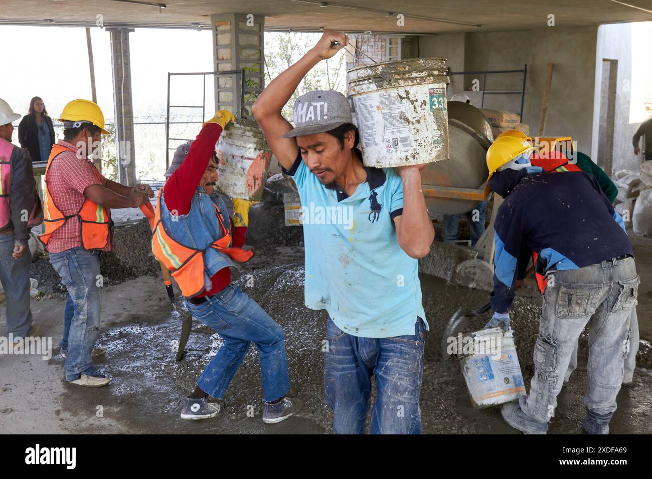 Mexican construction workers cement pouring concrete Stock Photo - Alamy