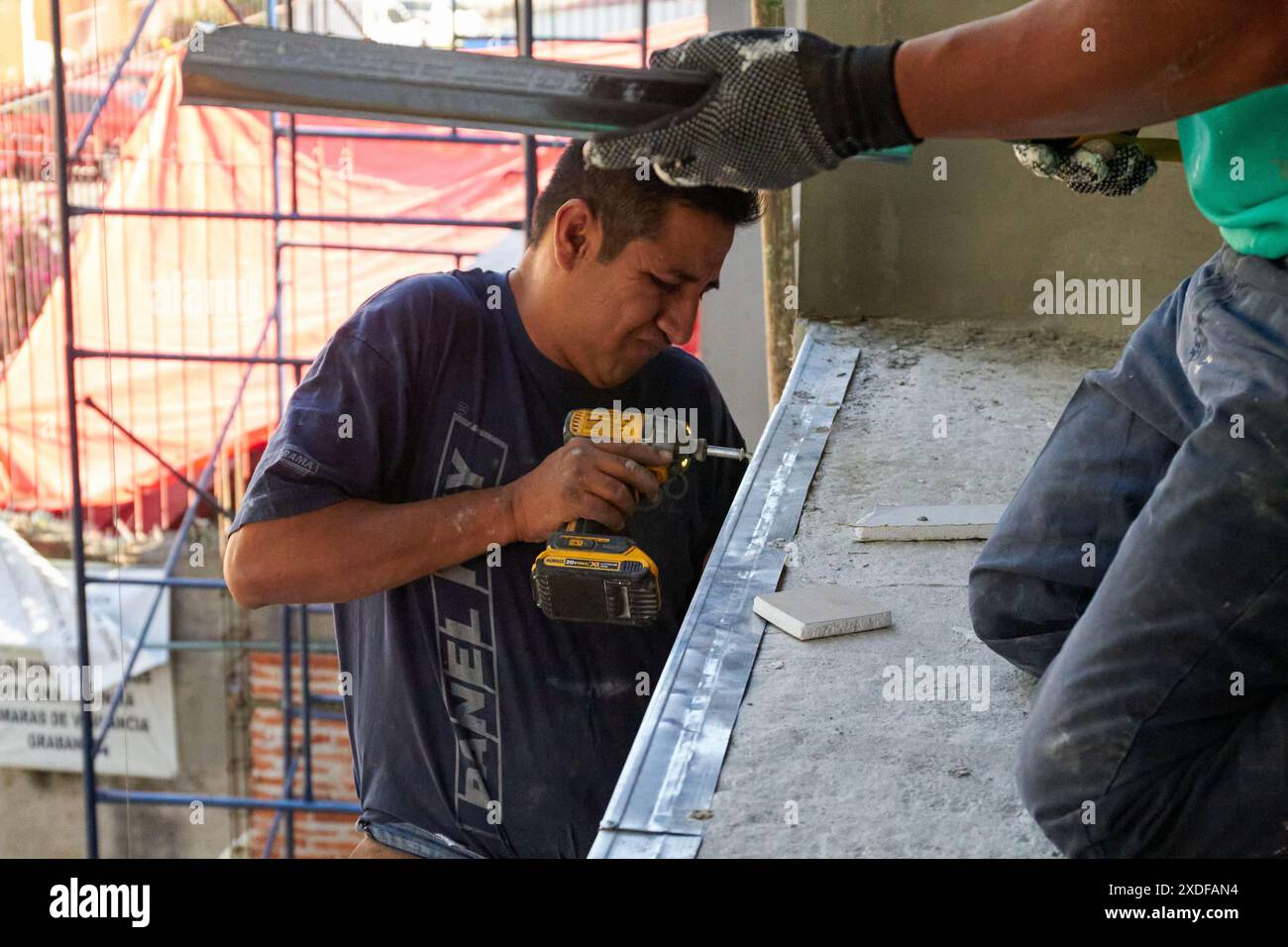 Mexican construction workers finishing interior house Stock Photo - Alamy