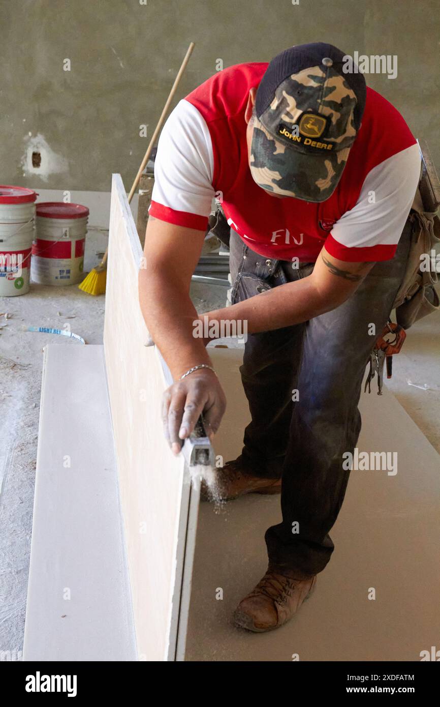 Mexican construction workers finishing interior house Stock Photo - Alamy