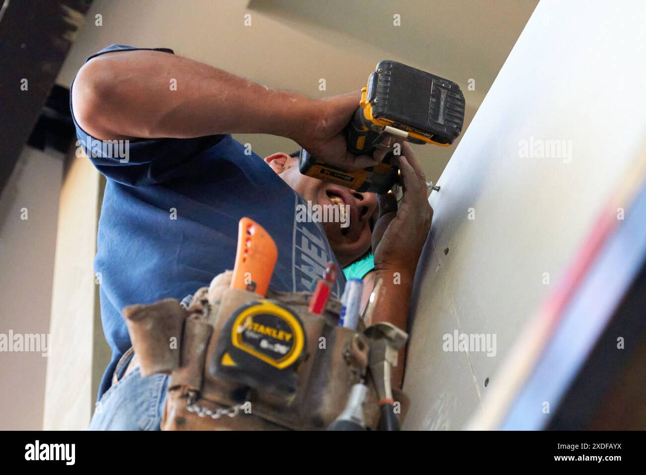 Mexican construction workers finishing interior house Stock Photo - Alamy