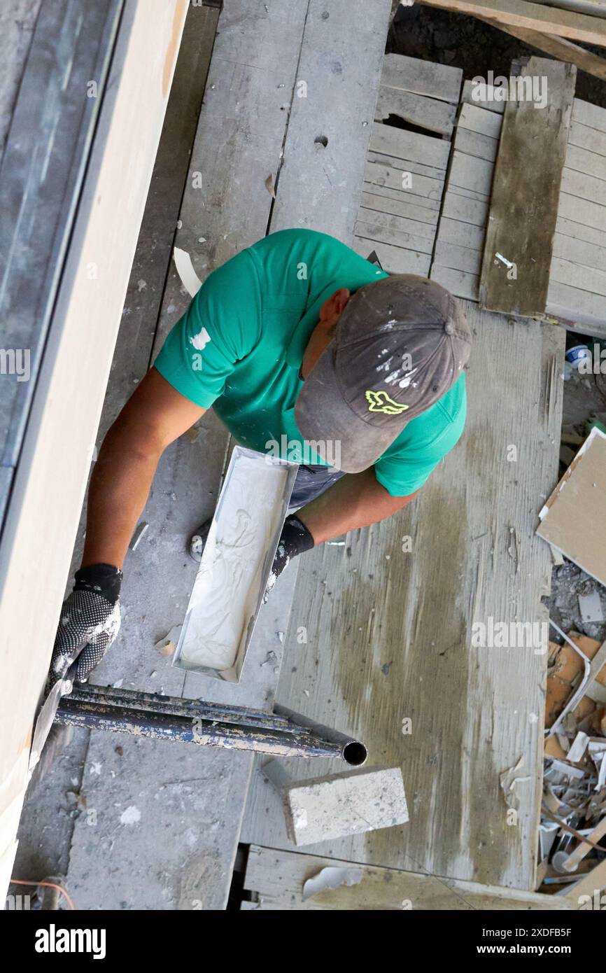 Mexican construction workers finishing interior house Stock Photo - Alamy