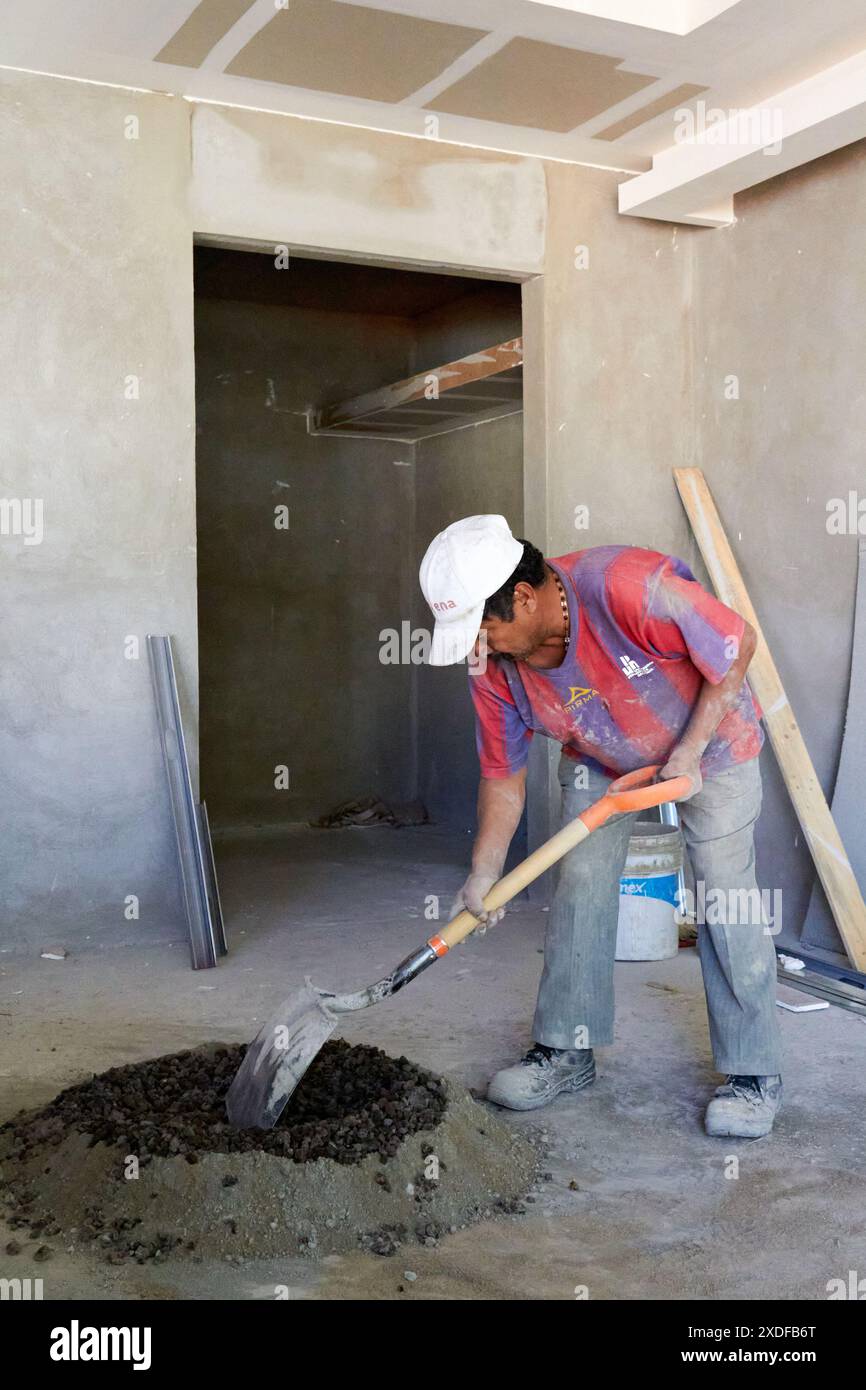 Mexican construction workers finishing interior house Stock Photo - Alamy