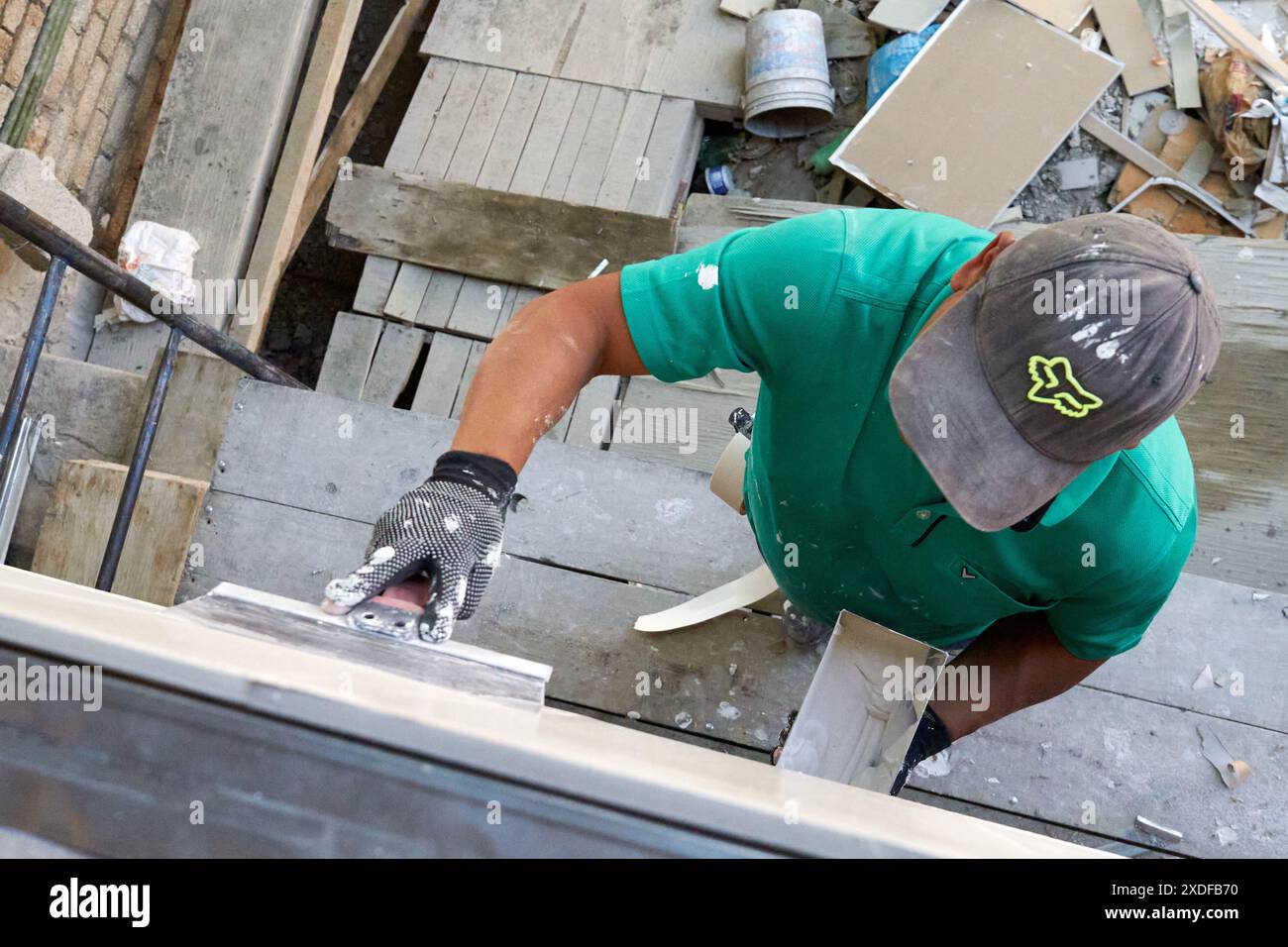 Mexican construction workers finishing interior house Stock Photo - Alamy