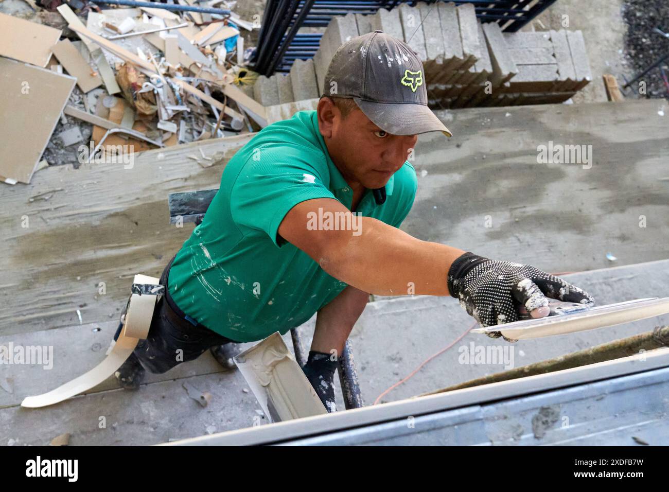 Mexican construction workers finishing interior house Stock Photo - Alamy