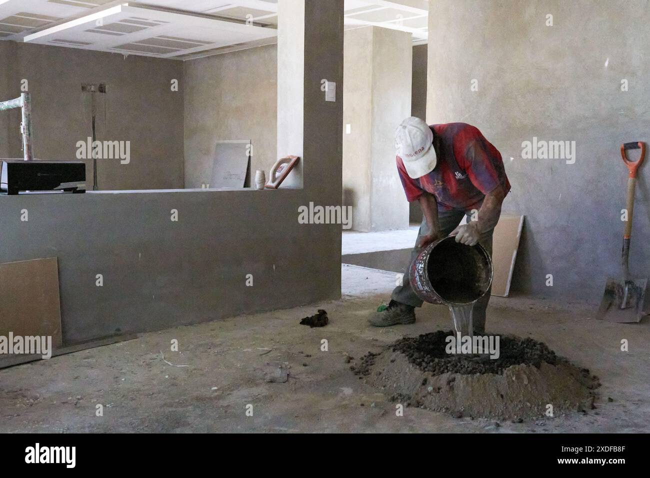 Mexican construction workers finishing interior house Stock Photo - Alamy