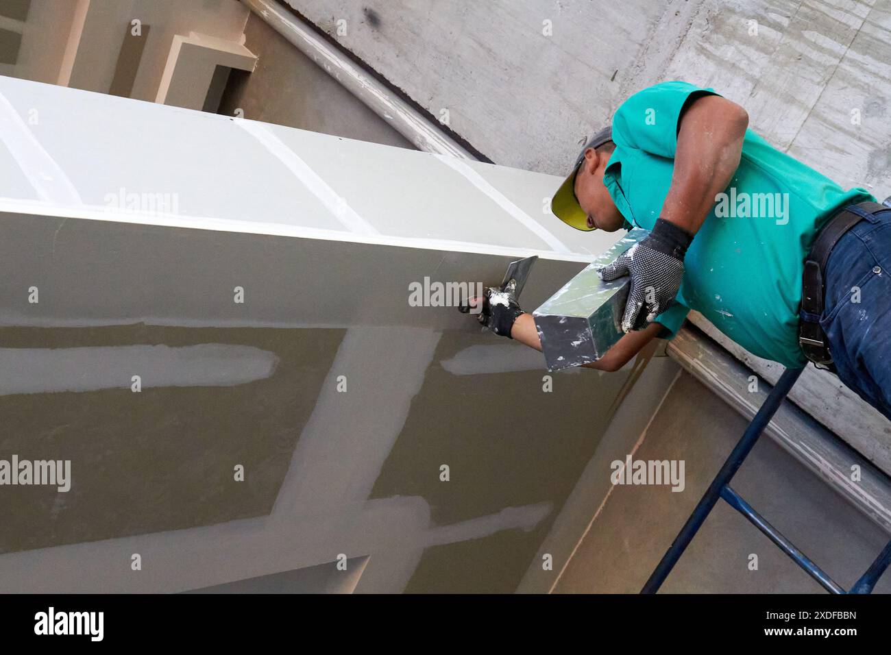 Mexican construction workers finishing interior house Stock Photo - Alamy