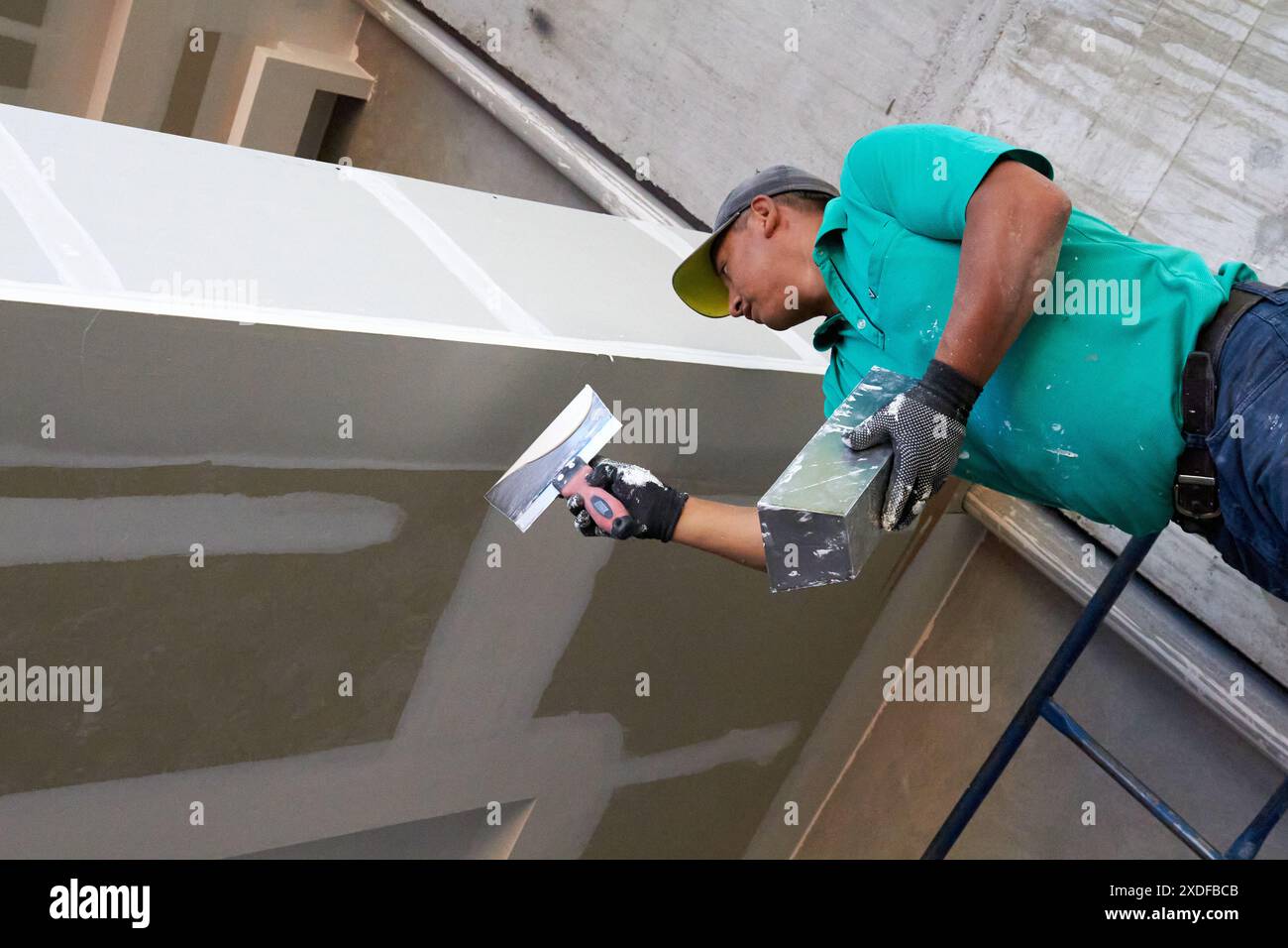 Mexican construction workers finishing interior house Stock Photo - Alamy