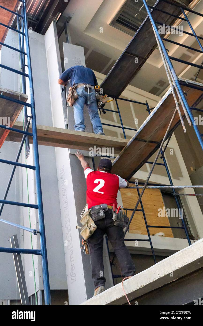 Mexican construction workers finishing interior house Stock Photo - Alamy