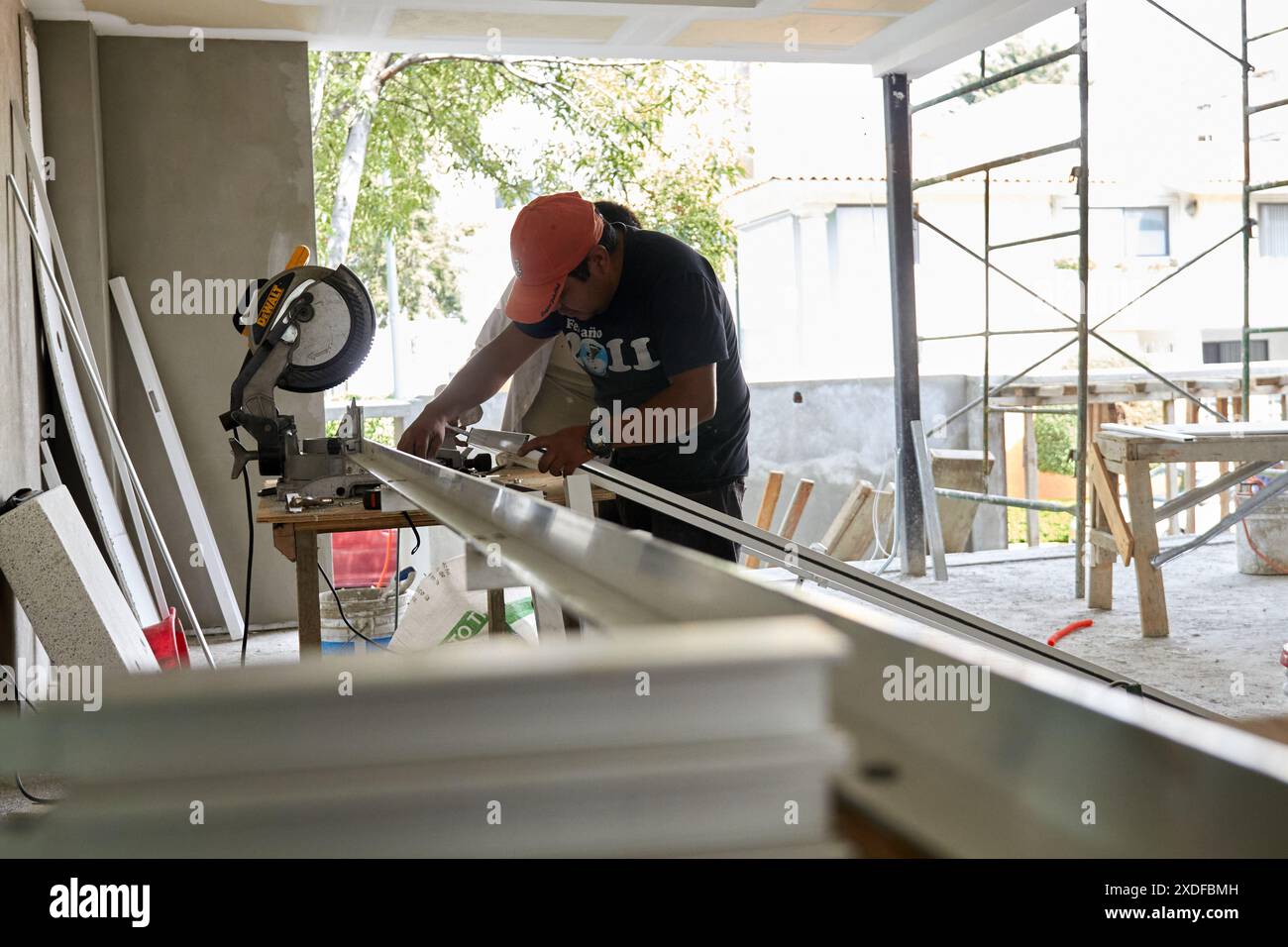 Mexican construction workers finishing interior house Stock Photo - Alamy