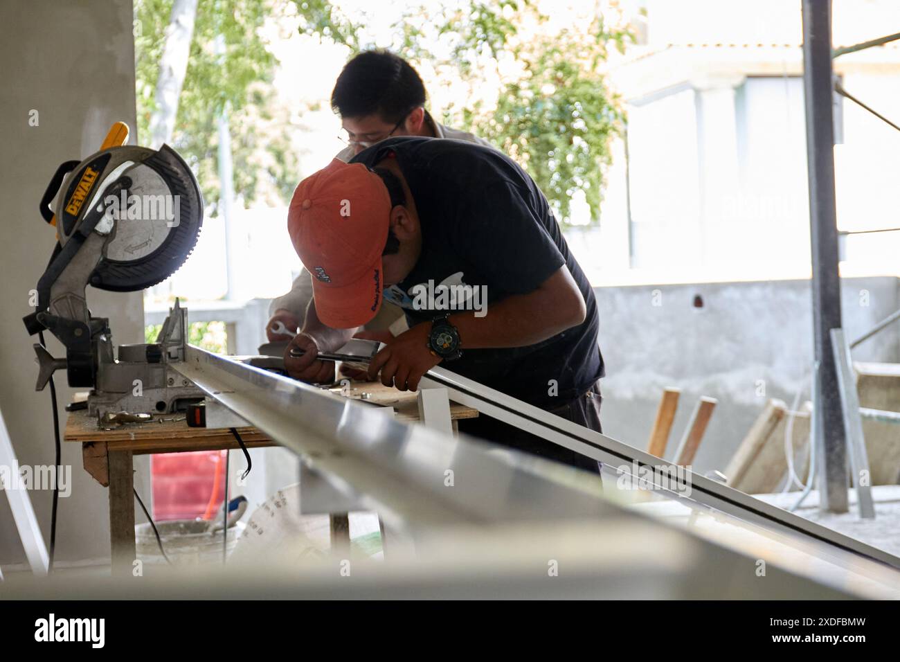 Mexican construction workers finishing interior house Stock Photo - Alamy