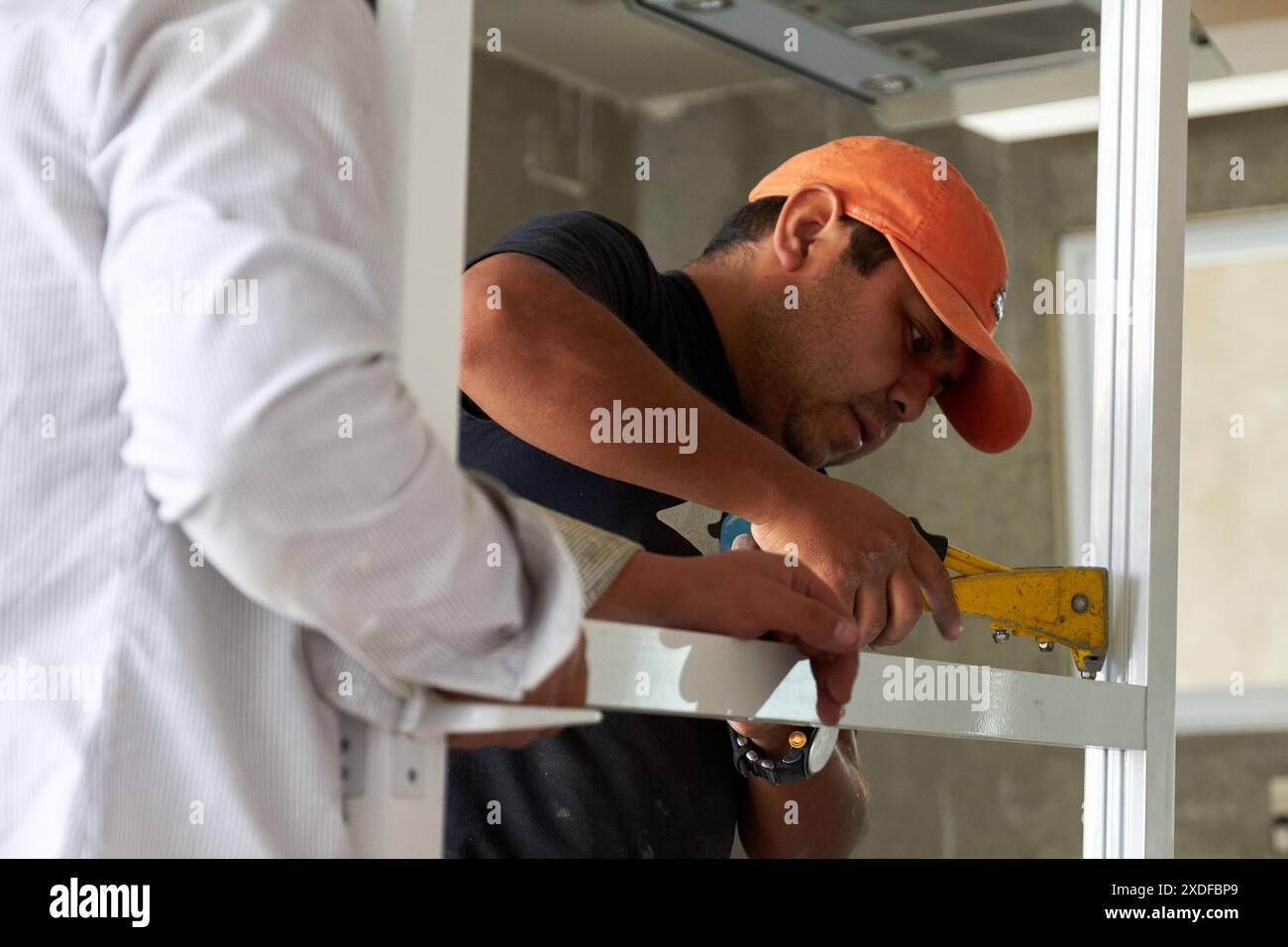 Mexican construction workers finishing interior house Stock Photo - Alamy