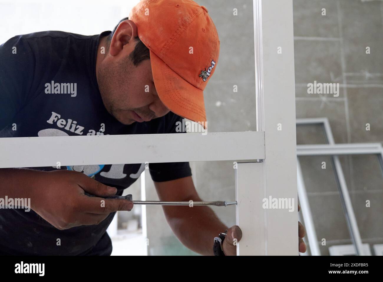 Mexican construction workers finishing interior house Stock Photo - Alamy