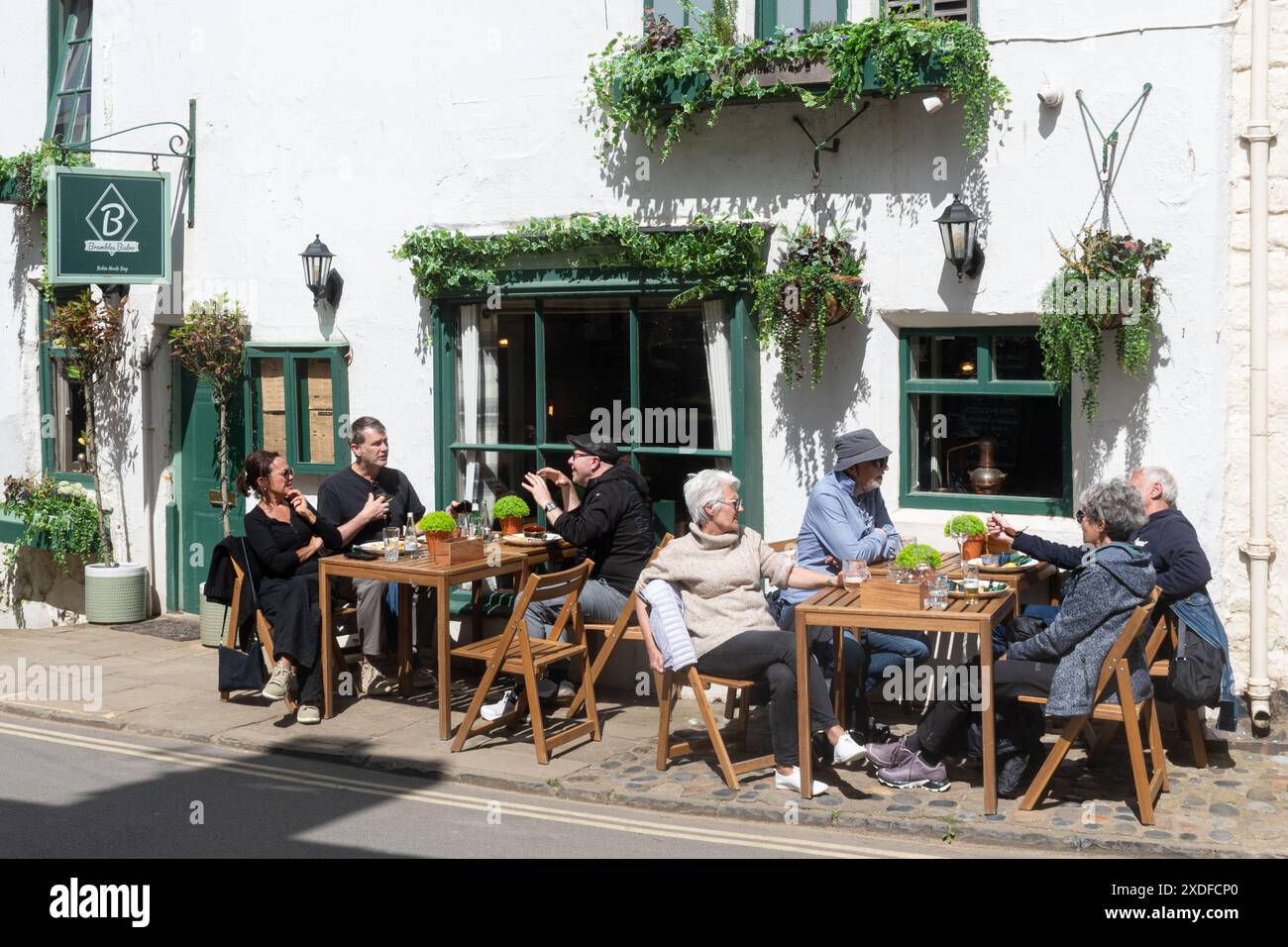 Visitors people sitting outside Brambles Bistro in Robin Hood's Bay ...