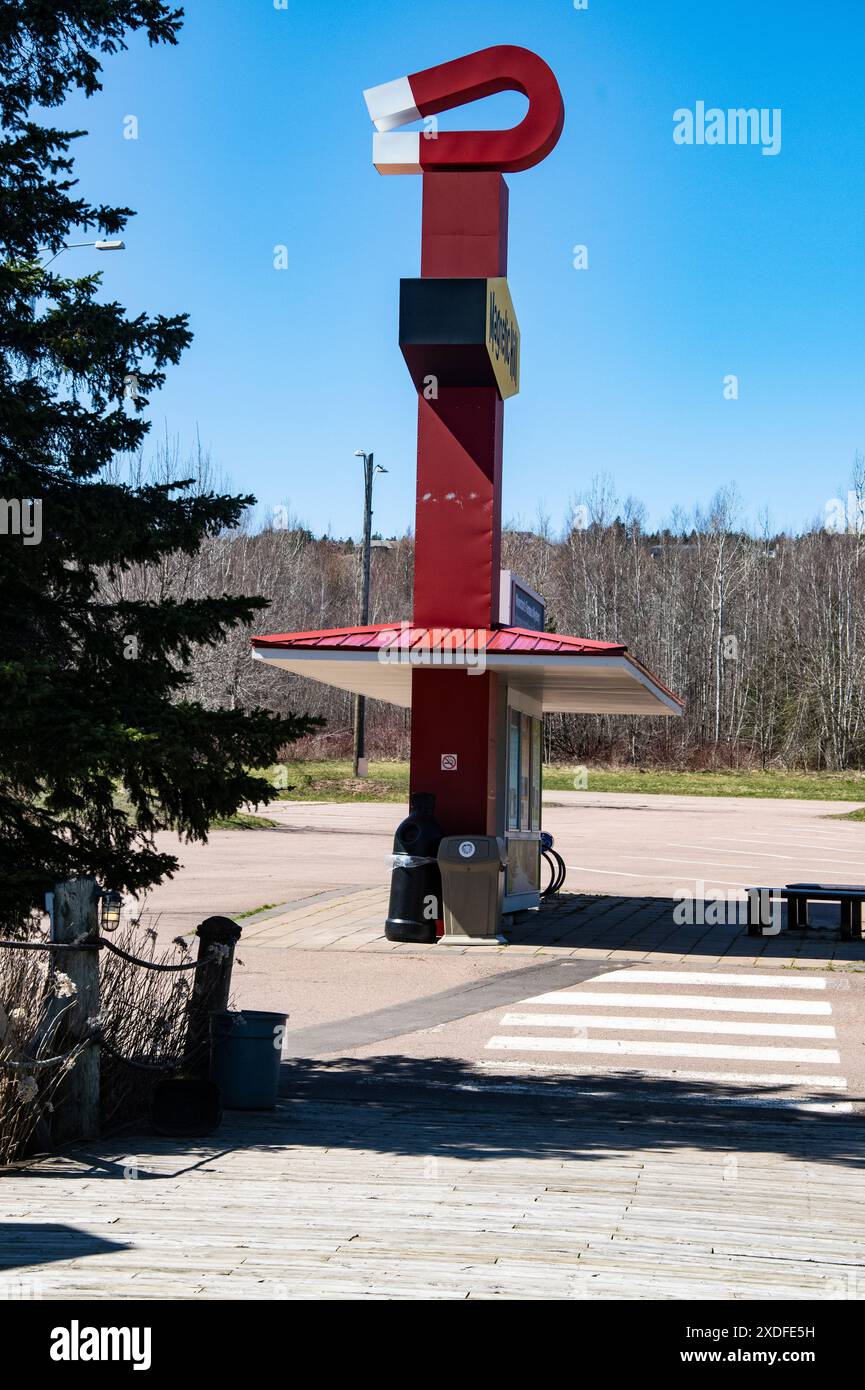 Magnetic Hill sign and kiosk in the parking lot in Moncton, New ...