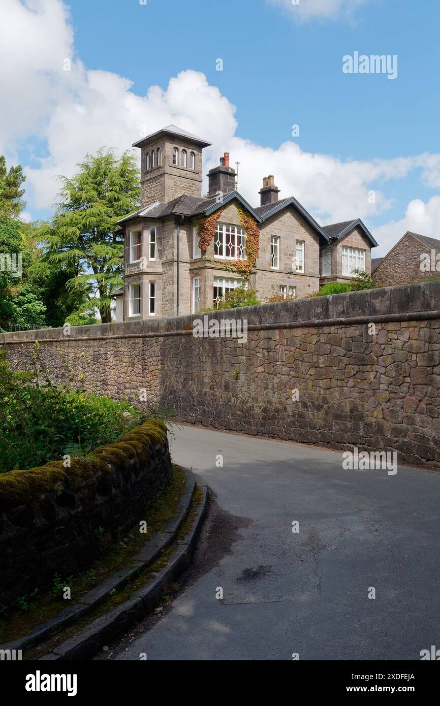 Quaint stone built mansion house with high stone wall in Biddulph ...