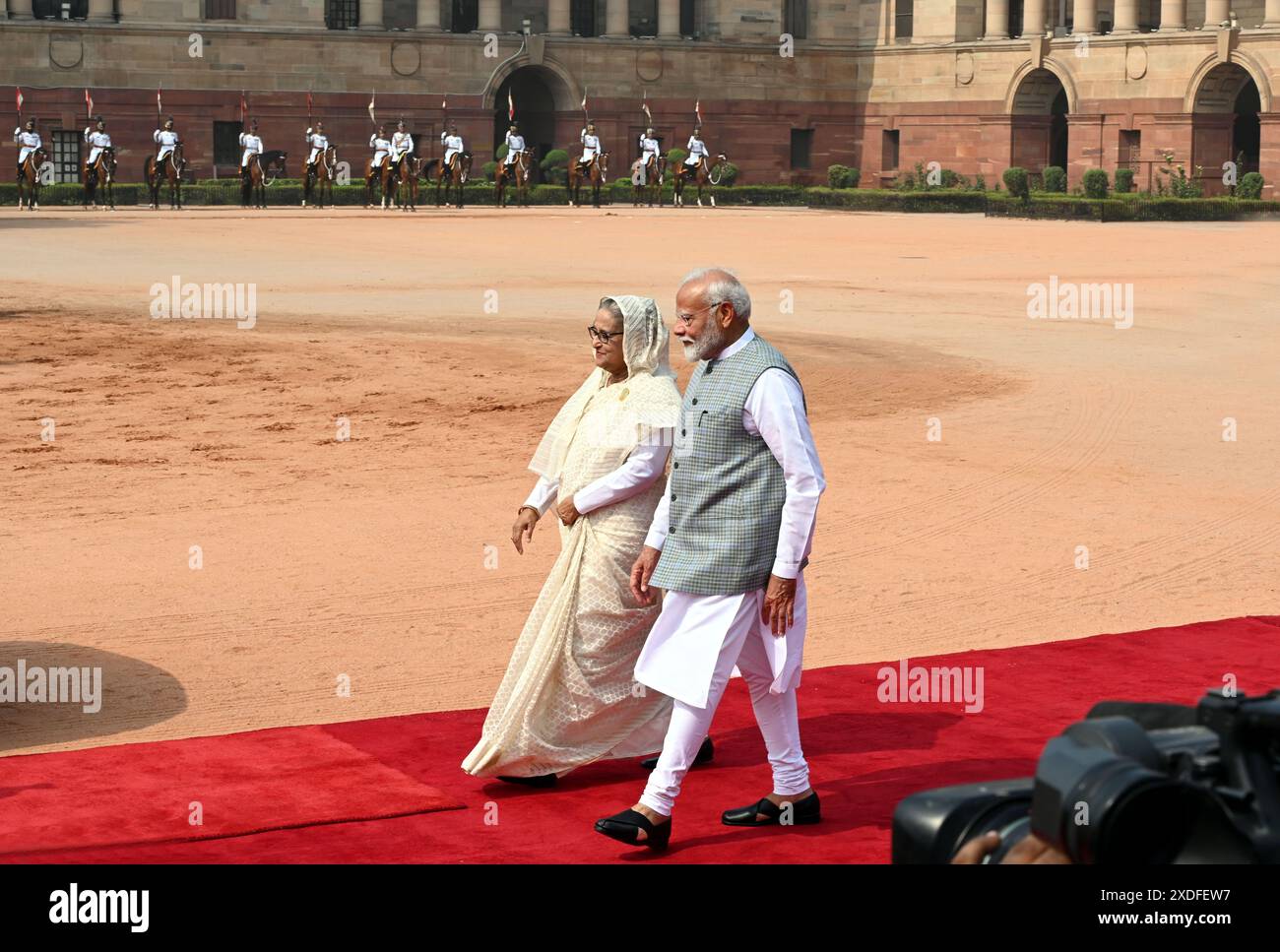 NEW DELHI, INDIA - JUNE 22: Prime Minister Narendra Modi, right, talks with his Bangladeshi ...