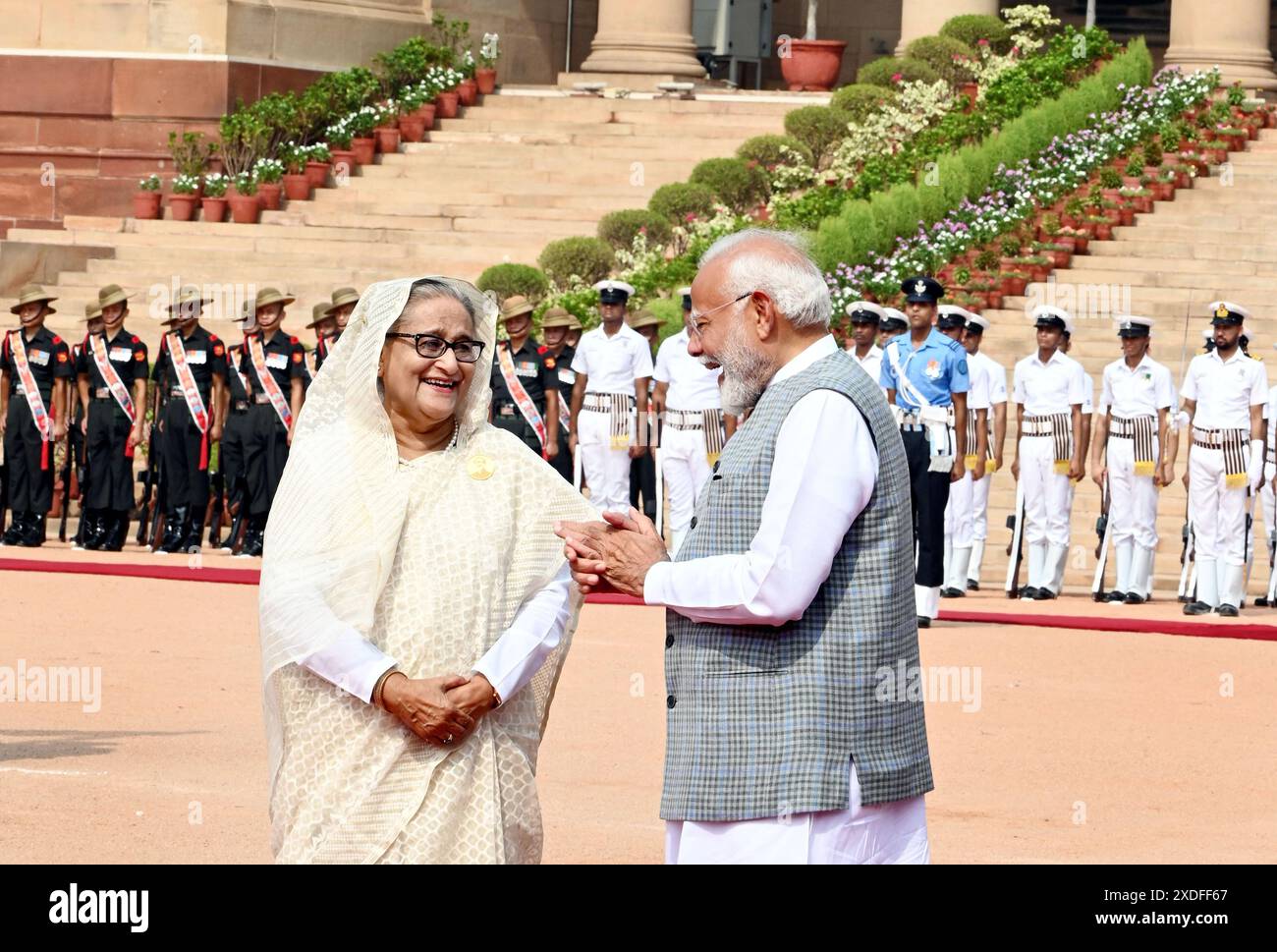 NEW DELHI, INDIA - JUNE 22: Prime Minister Narendra Modi, right, talks with his Bangladeshi ...