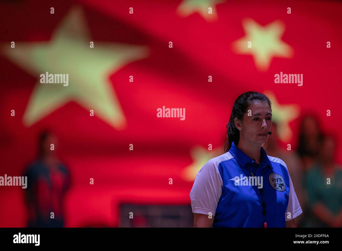 Referee stand up during the national anthems before the match in Hong ...