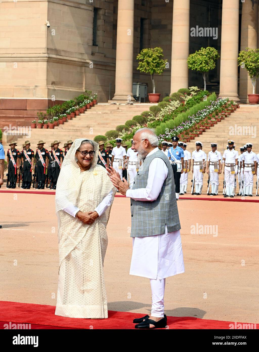 NEW DELHI, INDIA - JUNE 22: Prime Minister Narendra Modi, right, talks with his Bangladeshi ...