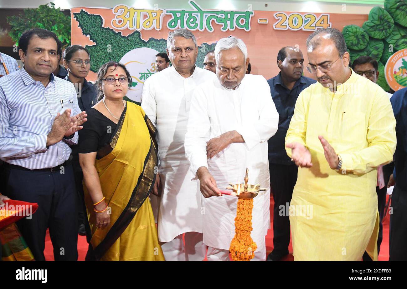 PATNA, INDIA - JUNE 22: Bihar Chief Minister Nitish Kumar lighting the ...