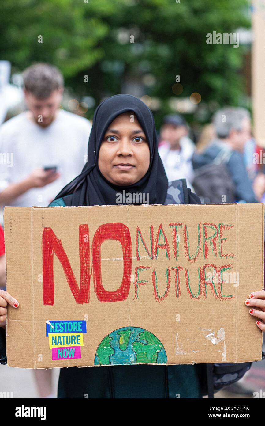 woman in hijab holds placard no nature no future Stock Photo - Alamy