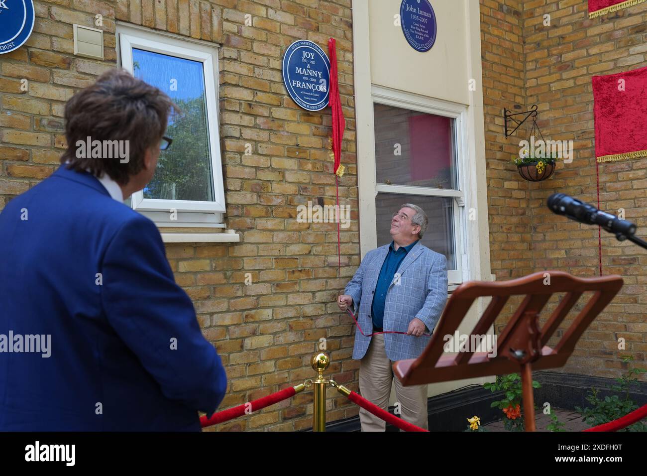 Broadcaster Mike Read (left) watches during a multi Blue Plaque ...